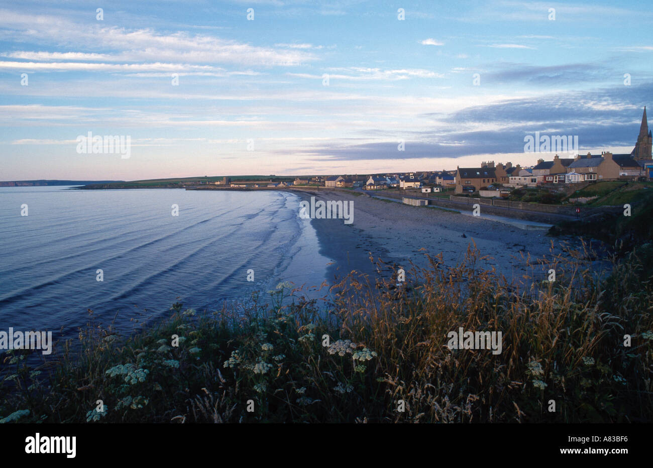 View along shore by fishing village town Scrabster THURSO SUTHERLAND ...