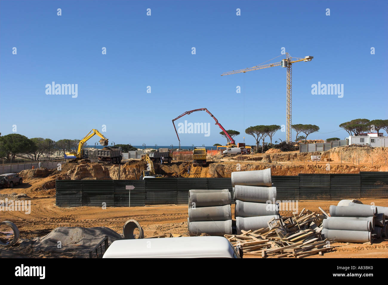 Busy building site where new villas and houses are being built to cater ...