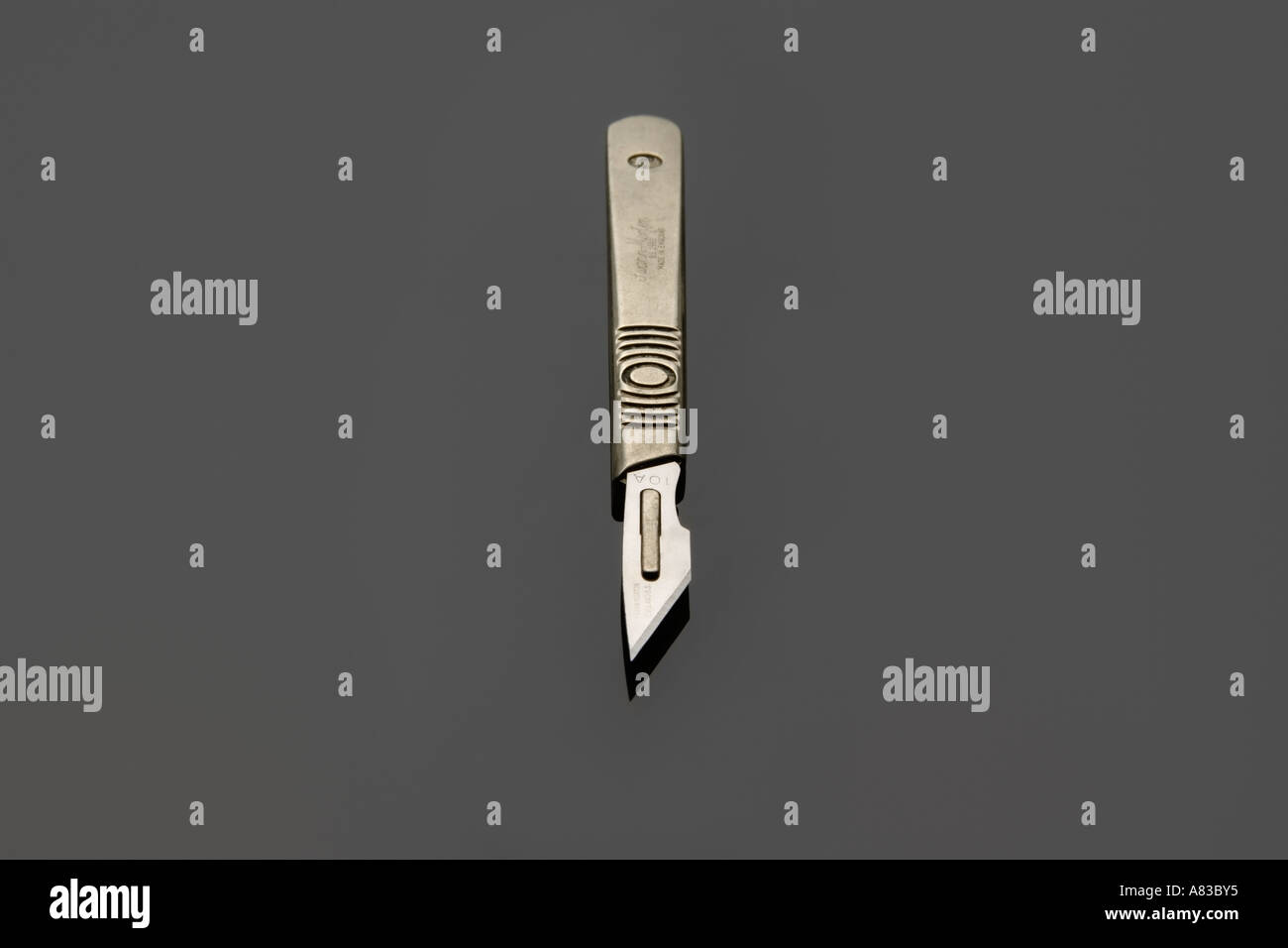 scalpel on a perspex background Stock Photo - Alamy
