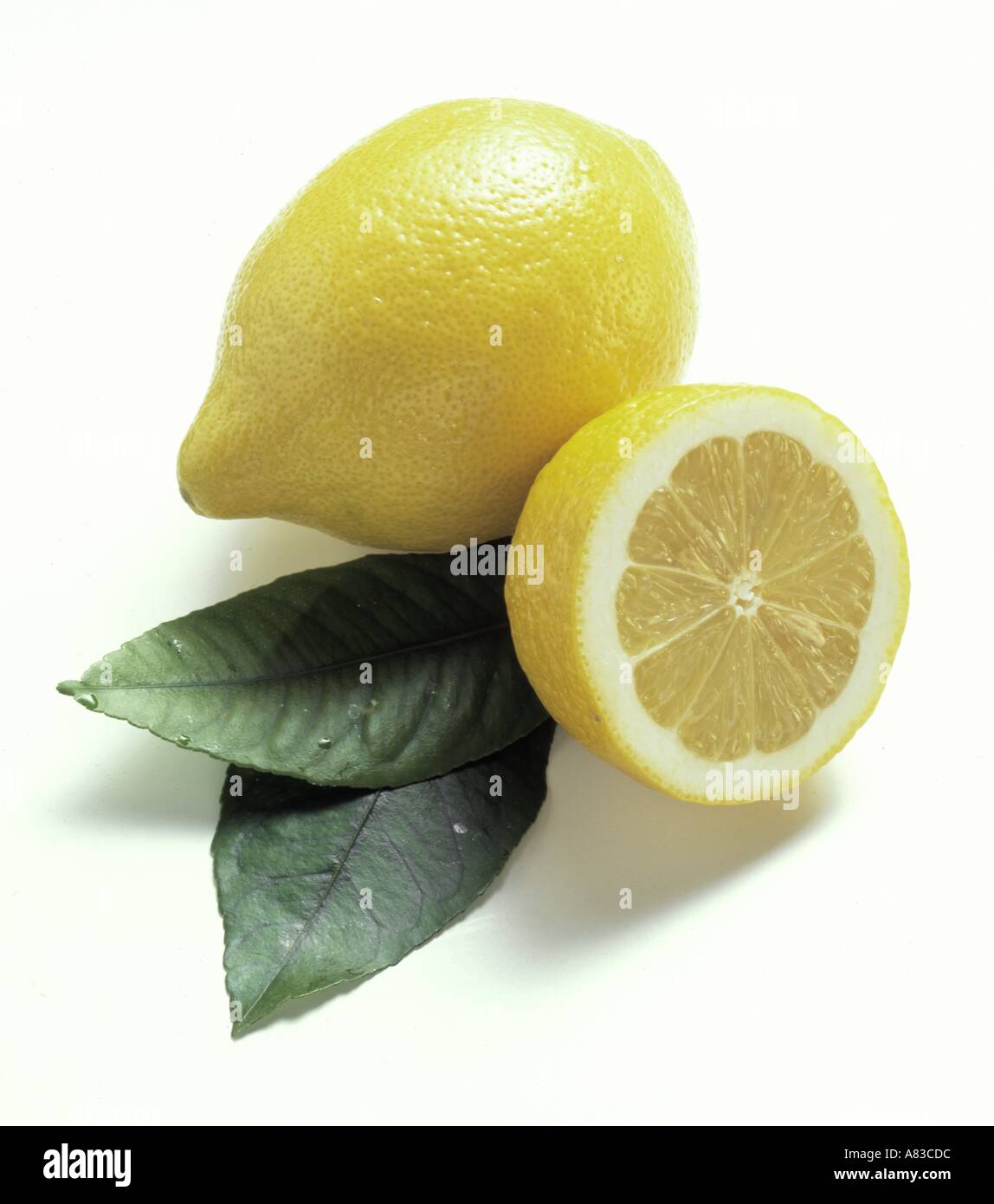 One Whole Lemon and One Half Lemon Stock Photo - Alamy
