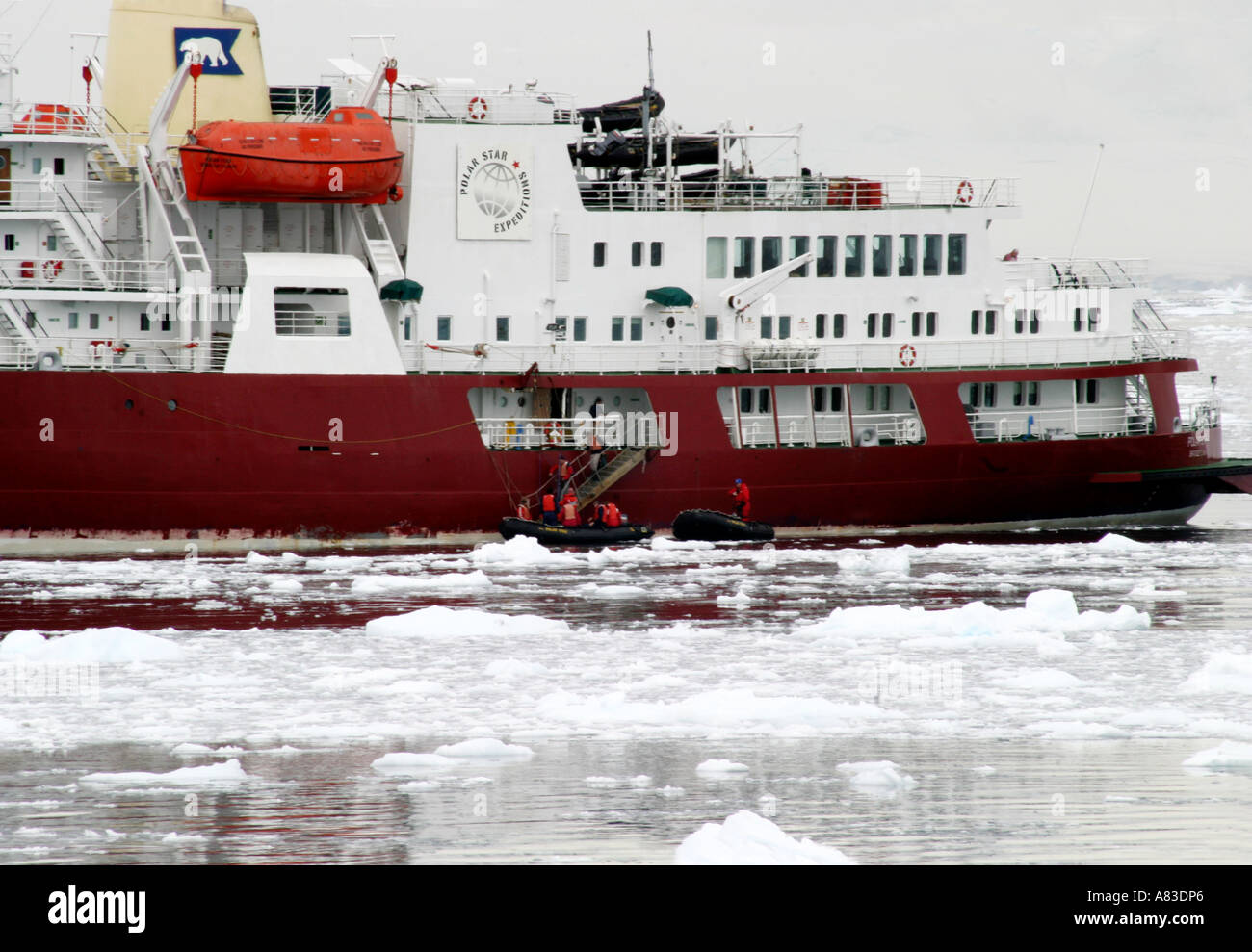 Red Antarctic Cruise ship Polar Star passengers on ship's zodiac ...