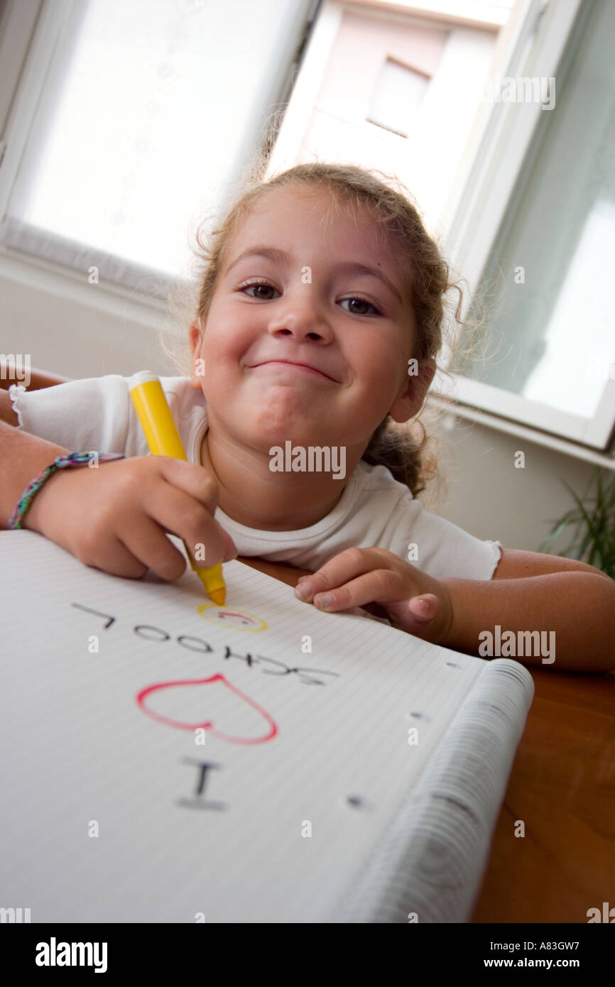 Pre-school child drawing happily at home Stock Photo - Alamy