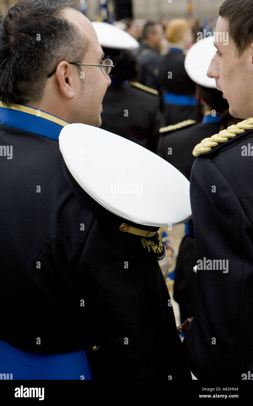 Band member in uniform with white military hat on shoulder in Plaza ...