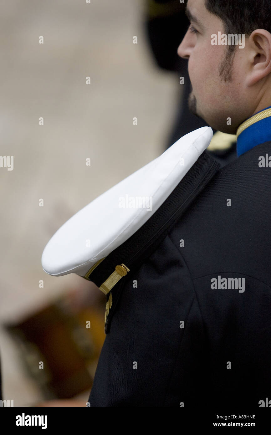 Band member in uniform with white military hat on shoulder in Plaza ...