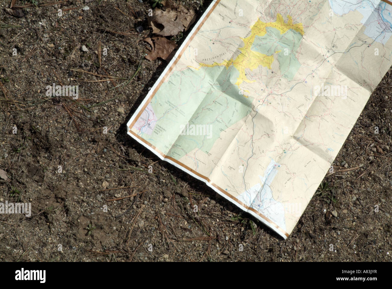 White Mountain National Forest map opened on the side of a hiking trail ...
