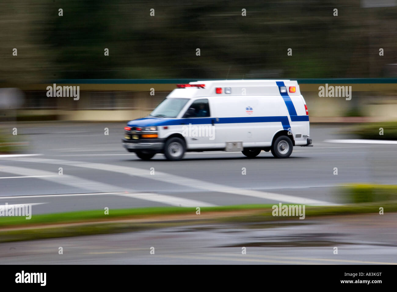 Ambulance in motion Stock Photo - Alamy