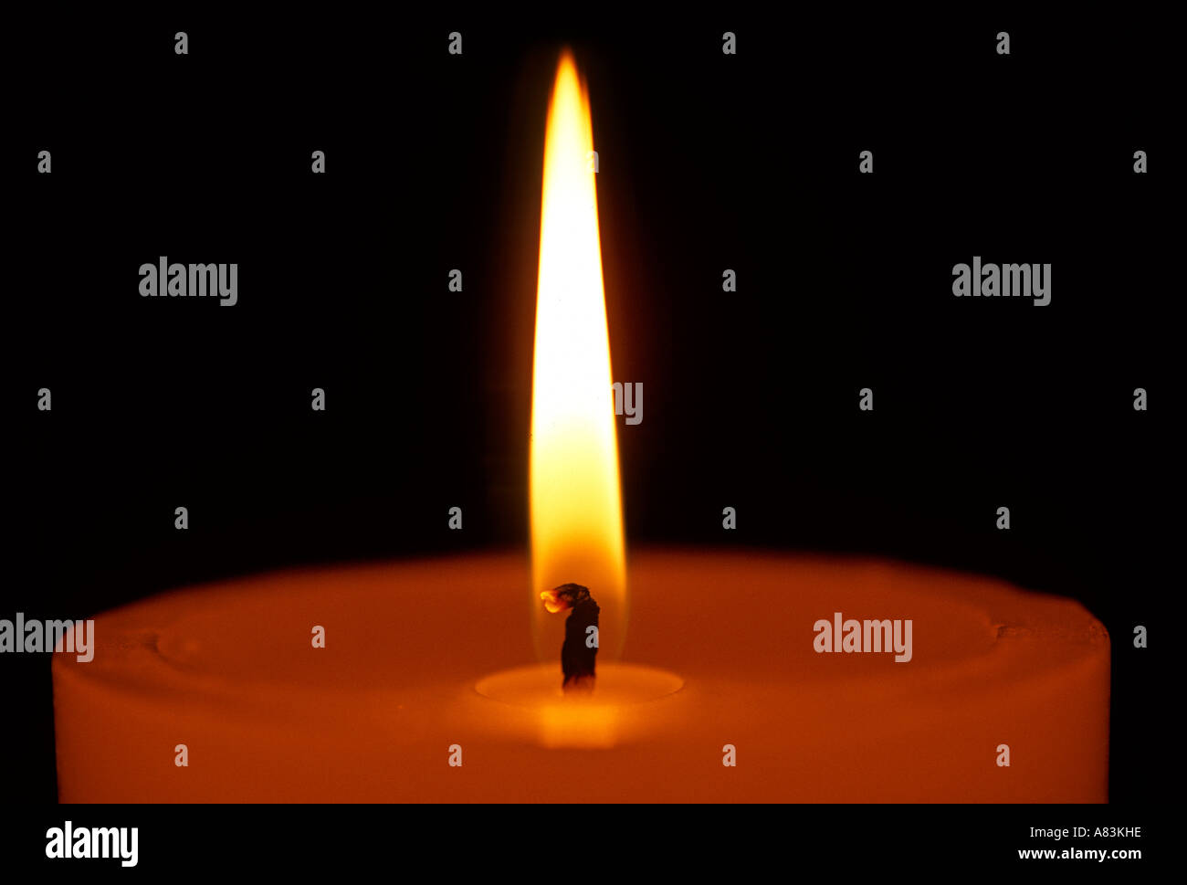 The flame of a single candle Stock Photo - Alamy