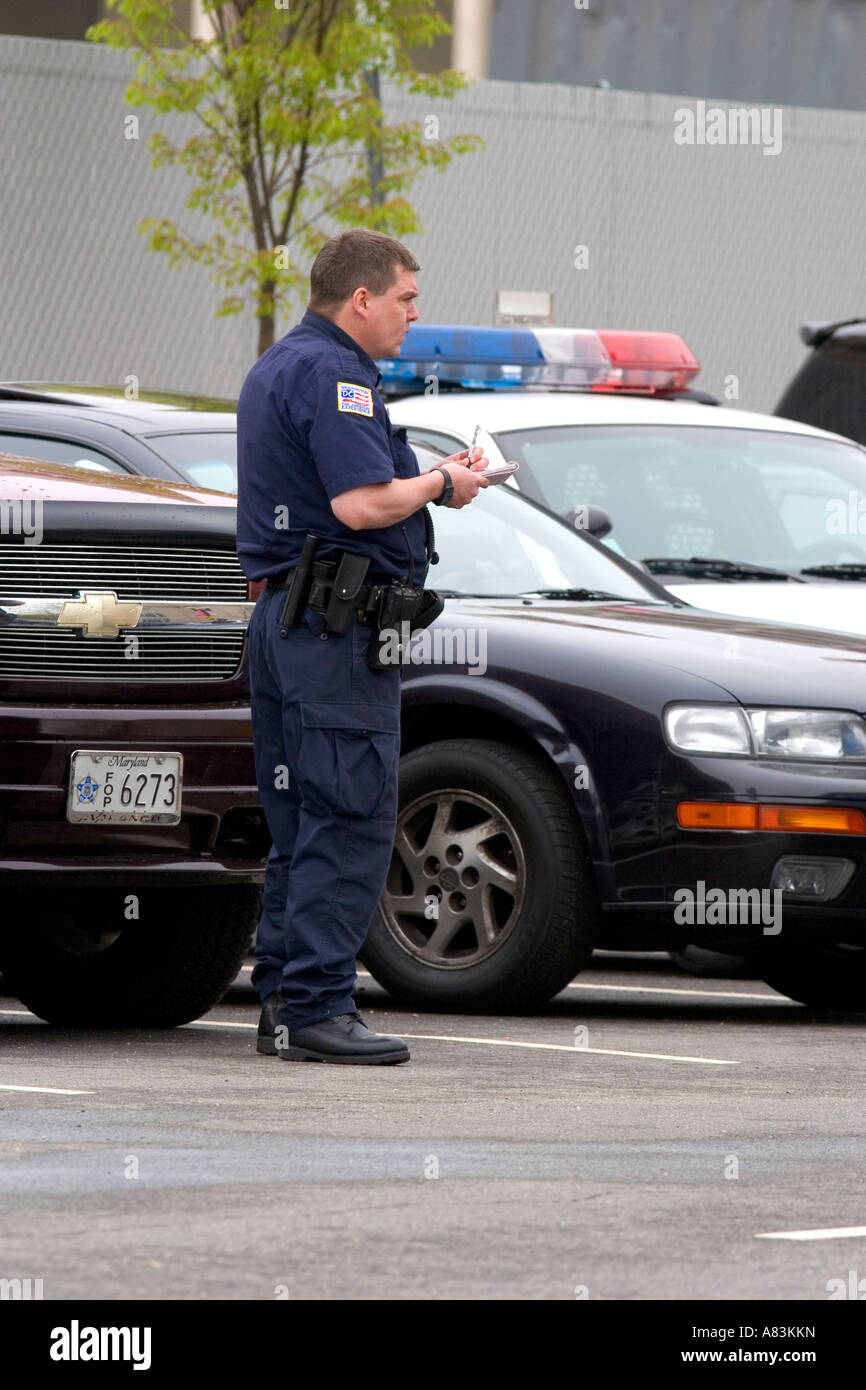 Police officer writing parking tickets in Washington D C Stock Photo ...