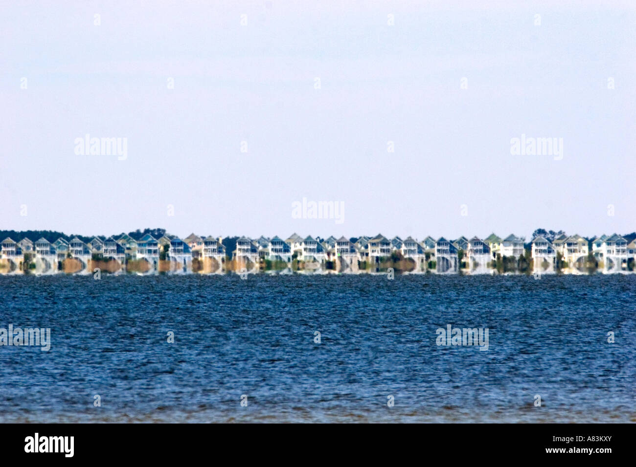 Heat waves and reflection cause distorted view of beach houses along ...