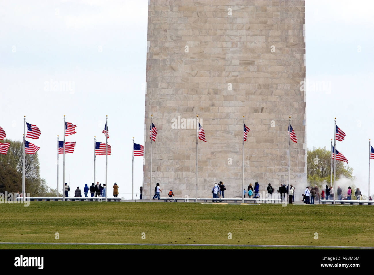 Visitors and flags at the Washington Monument in Washington D C Stock ...
