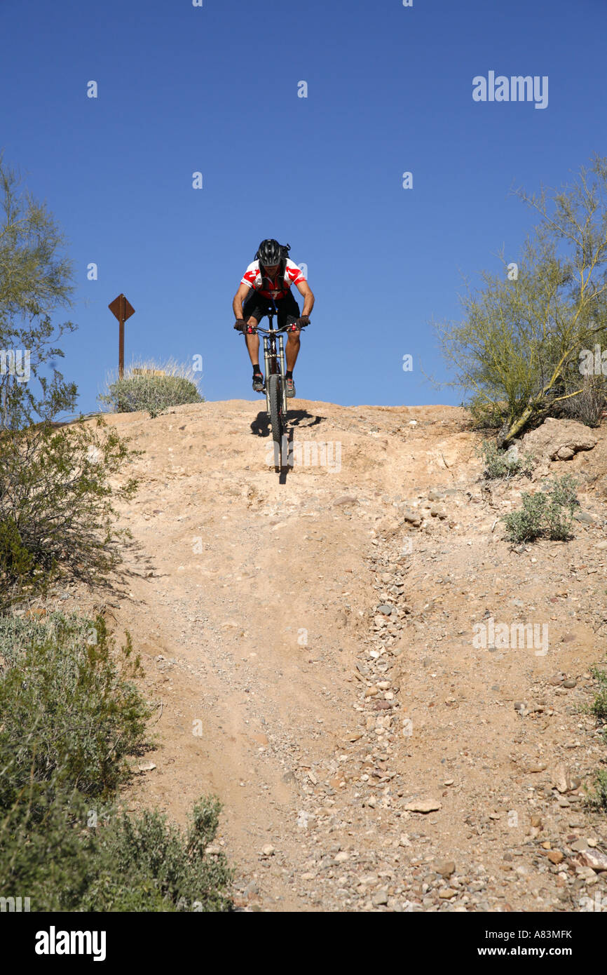 A mountain biker leaps off a ledge on the Technical Loop one of the ...