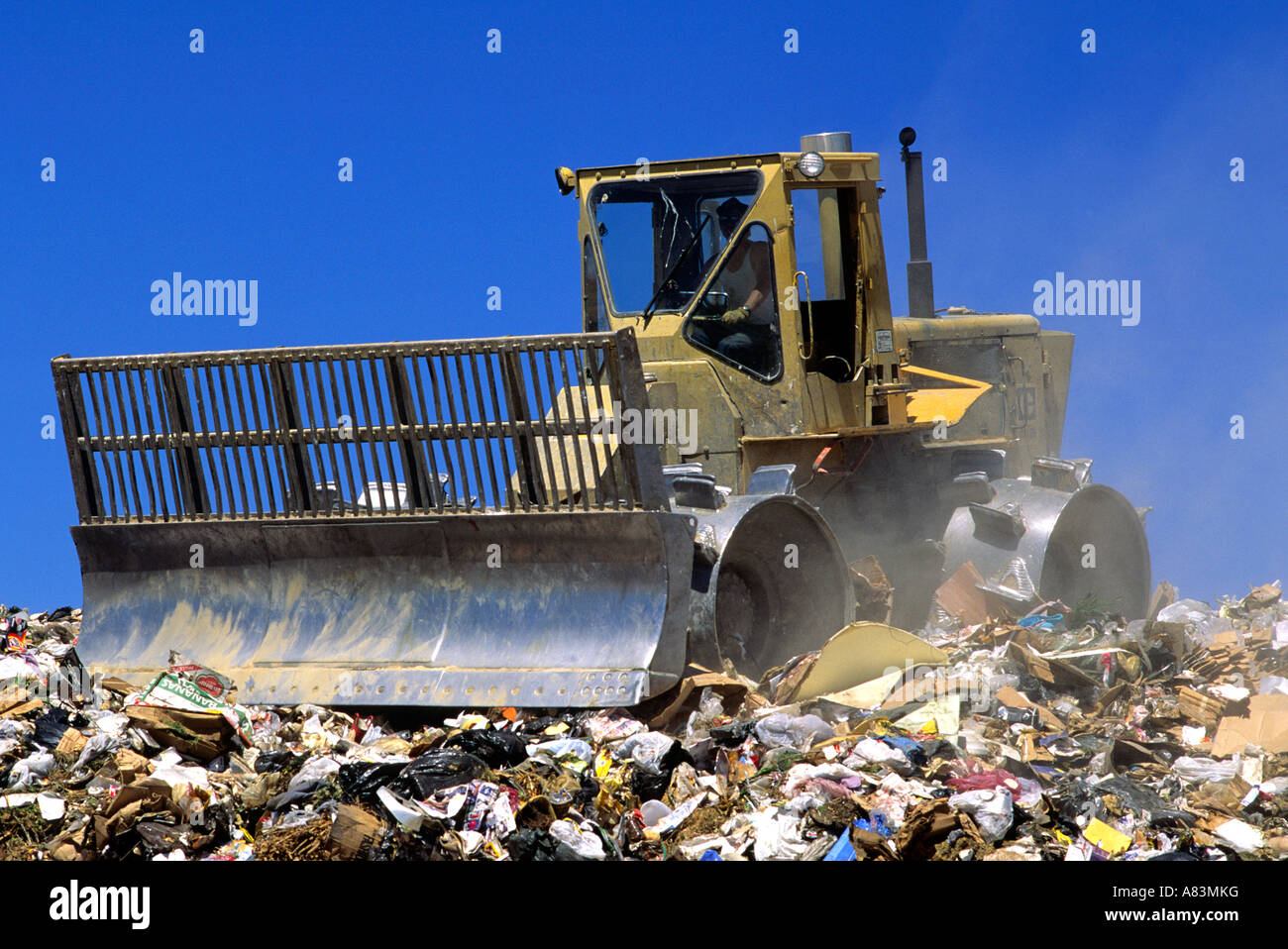 Bulldozer compacter working in a landfill in Boise Idaho Stock Photo ...