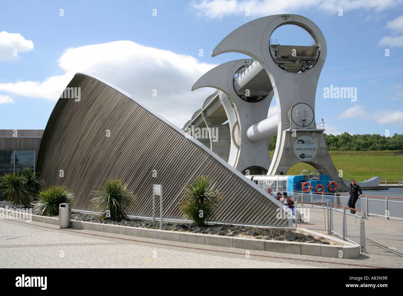 Falkirk Wheel a rotating boat lift joining Forth and Clyde canal with ...