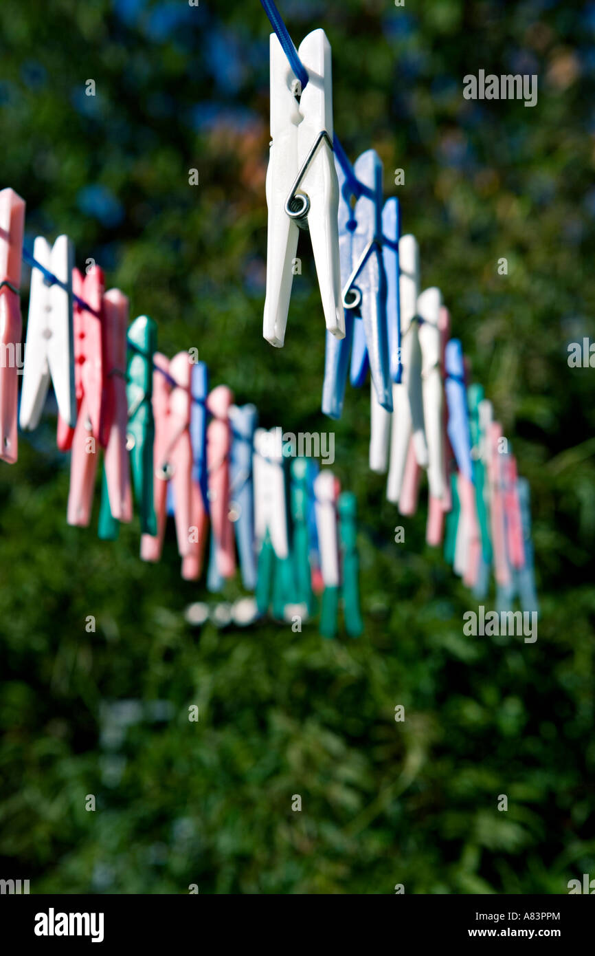 Plastic pegs on a clothes line Stock Photo - Alamy