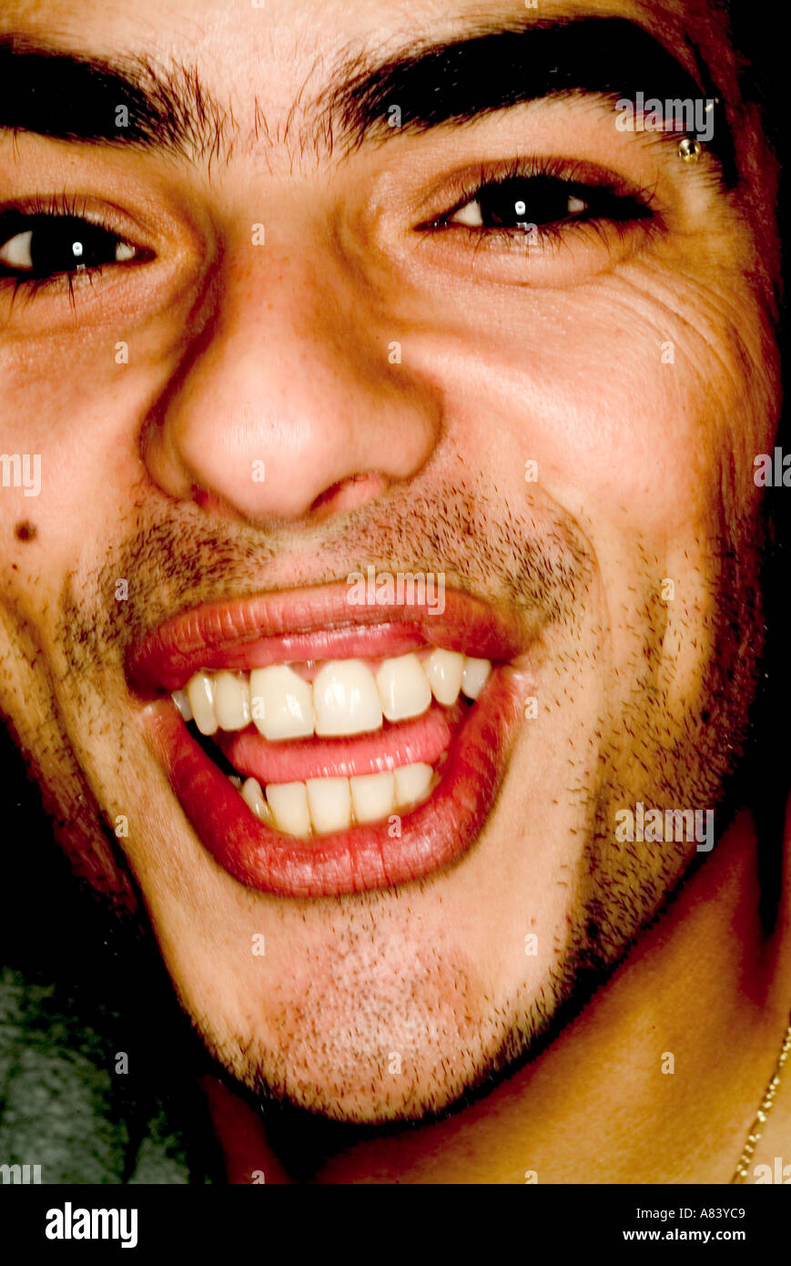 Portrait man looking into camera smiling Stock Photo - Alamy