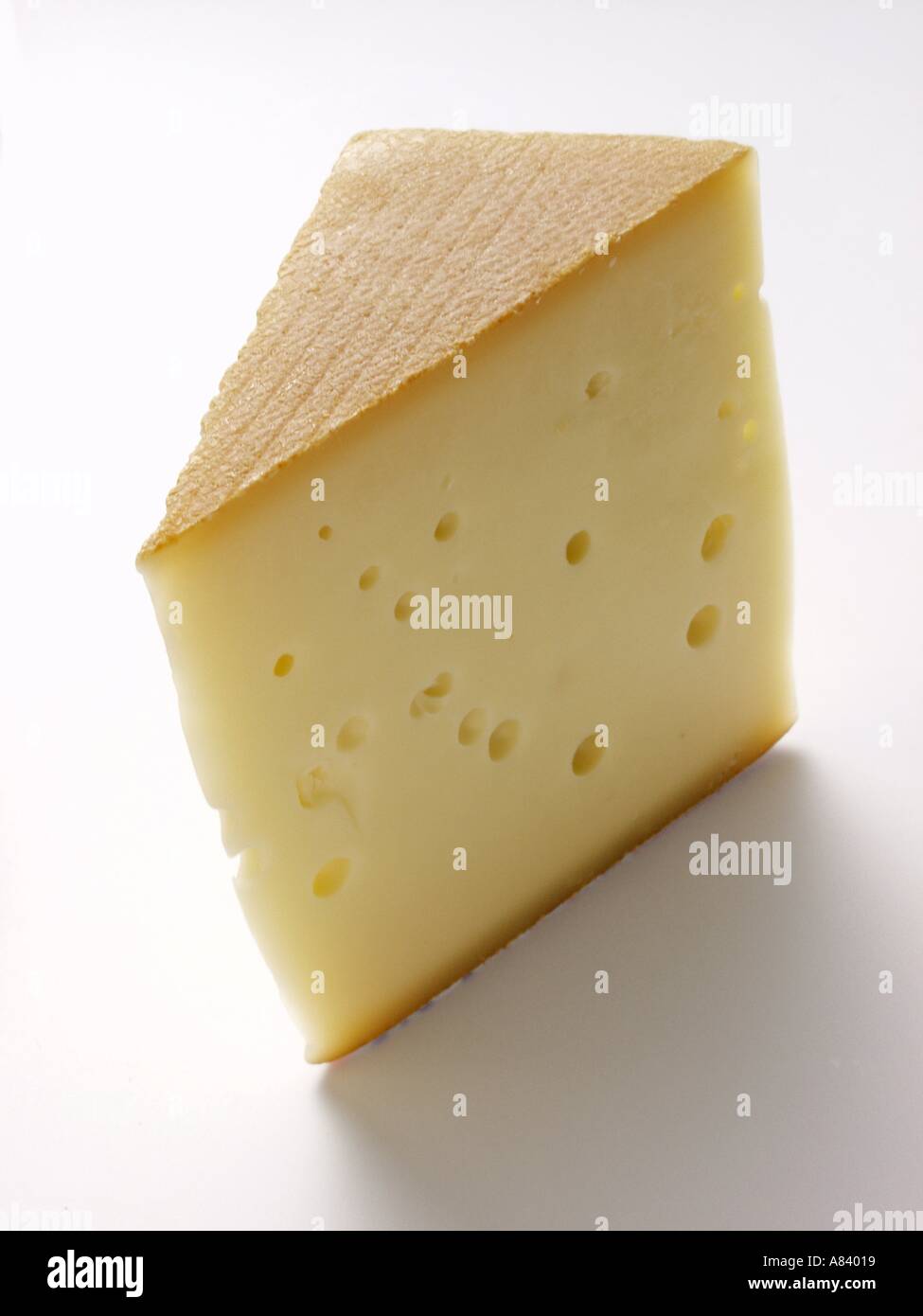 A Wedge of Swiss Cheese Stock Photo - Alamy