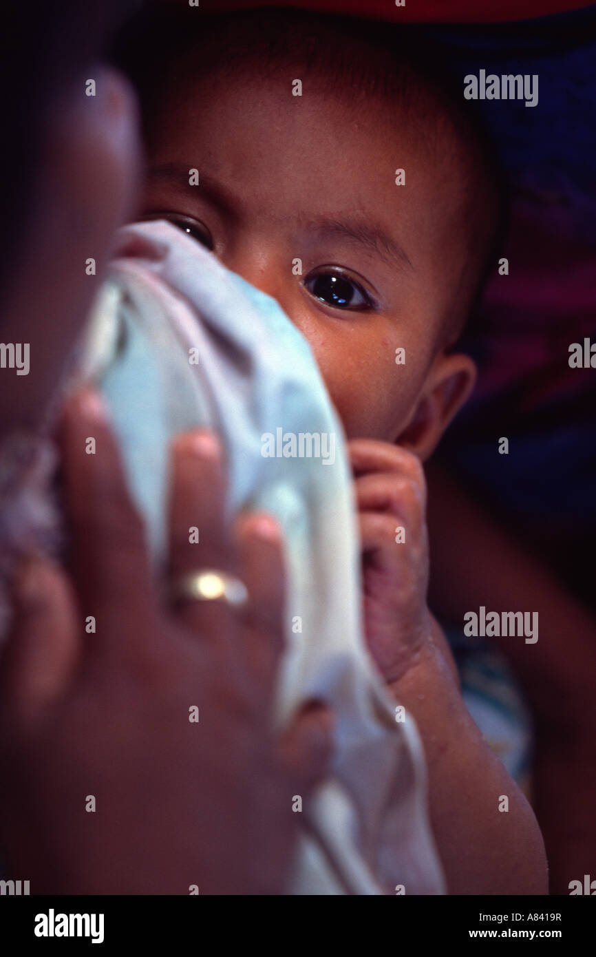 Gilbertese mum feeds her child, Kiribati, South Pacific Stock Photo - Alamy
