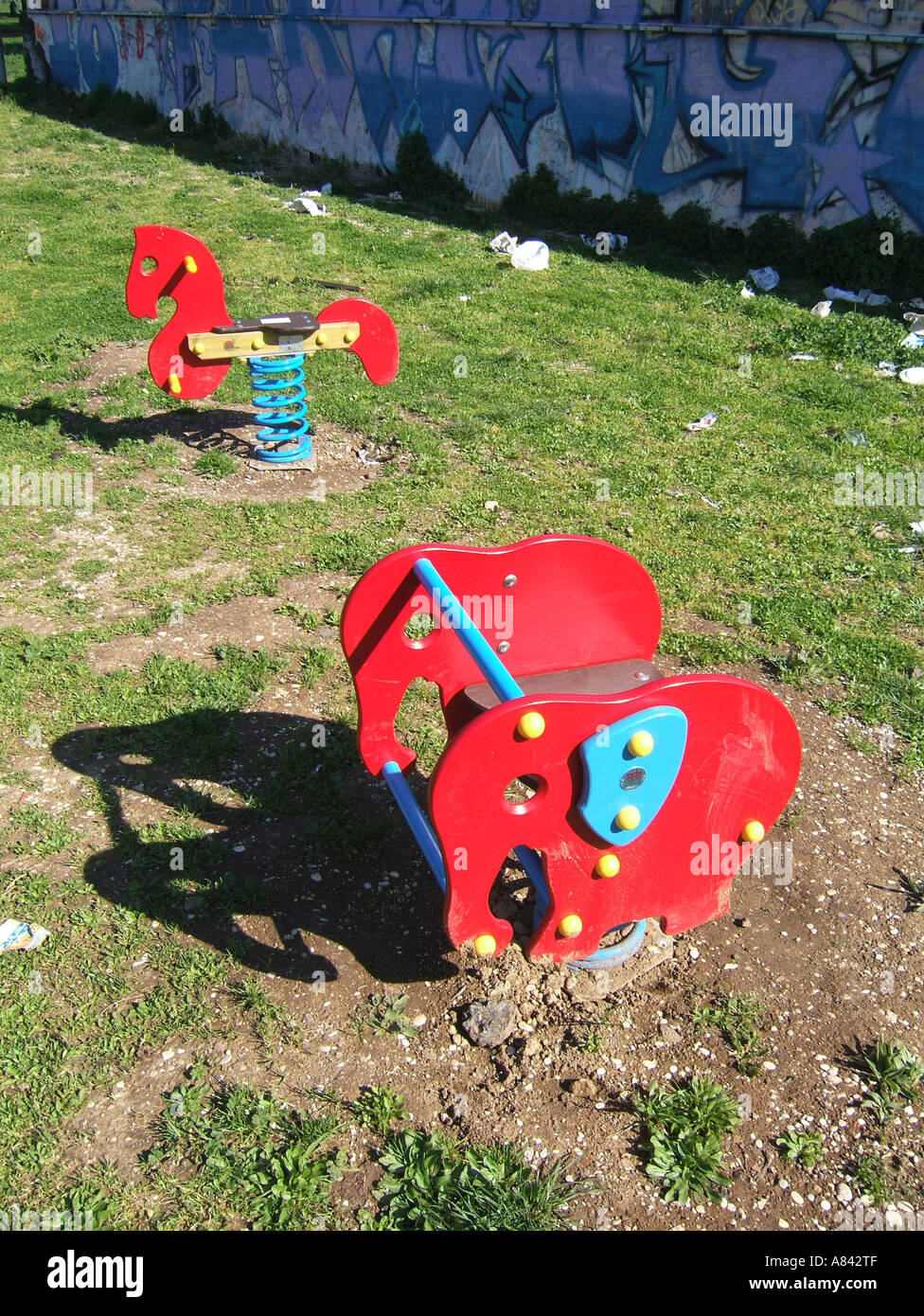 ride in run down urban decay playground Stock Photo - Alamy