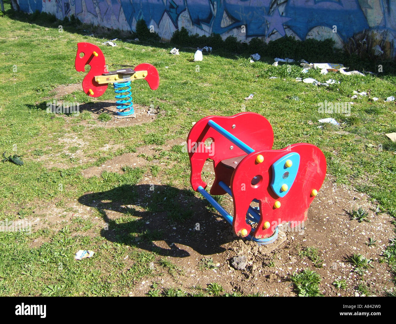 ride in run down urban decay playground Stock Photo - Alamy