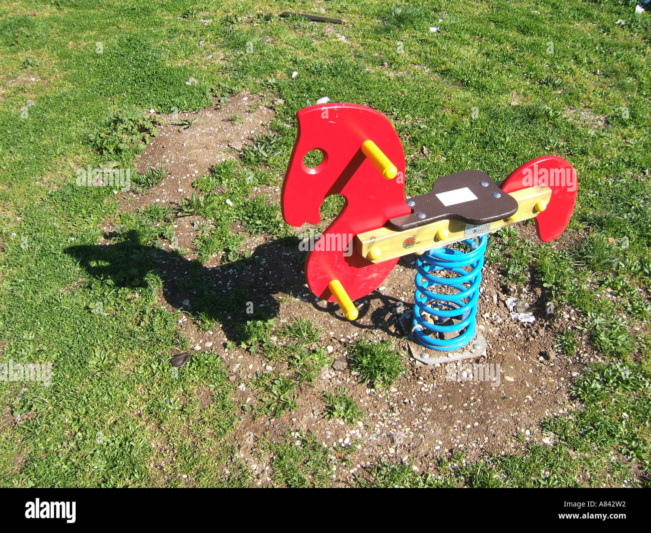 ride in run down urban decay playground Stock Photo - Alamy