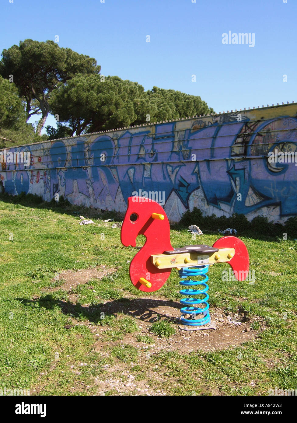 ride in run down urban decay playground Stock Photo - Alamy
