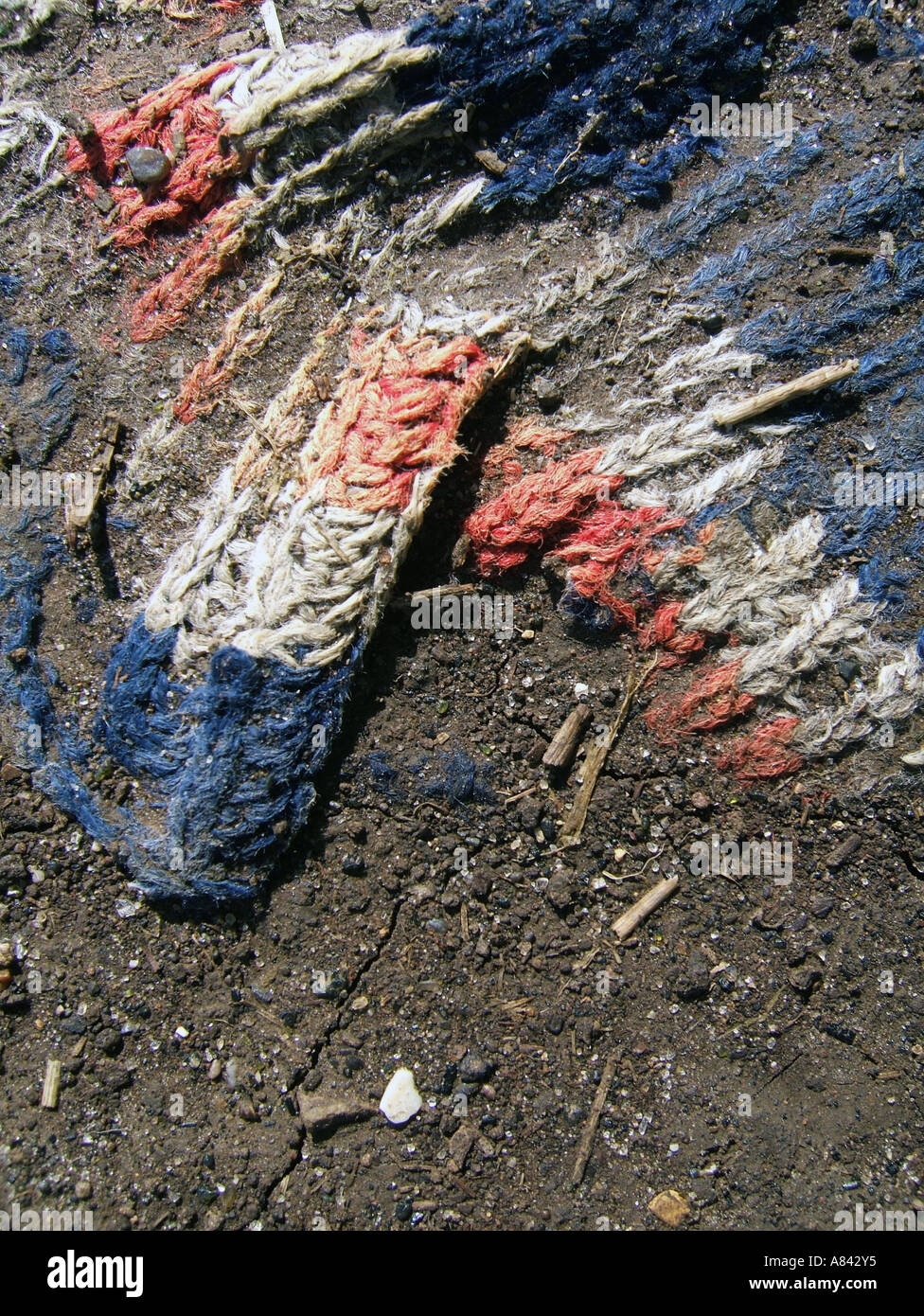 one dirty cap buried in earth Stock Photo - Alamy