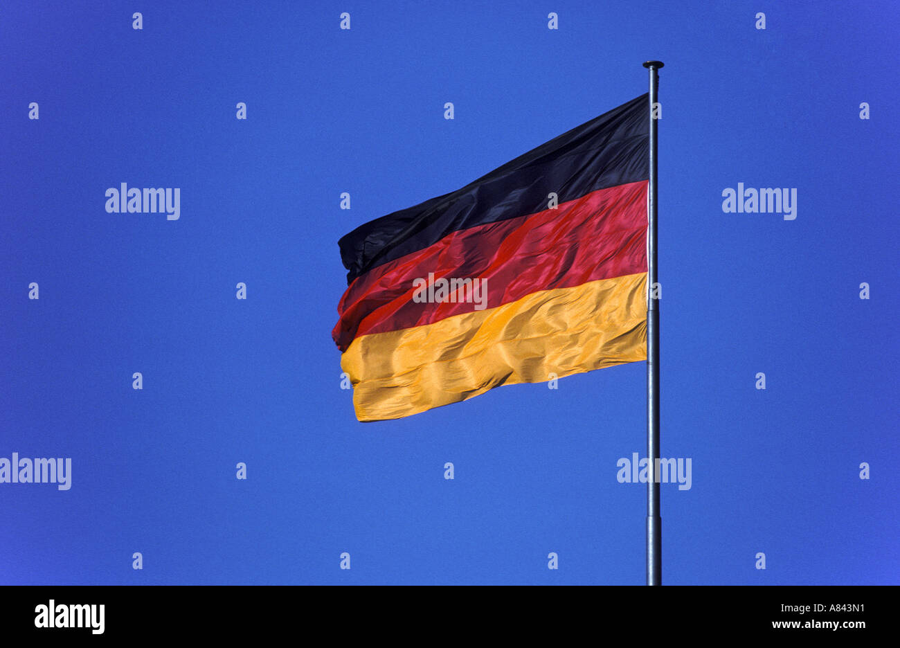 German flag blowing in the wind Stock Photo - Alamy