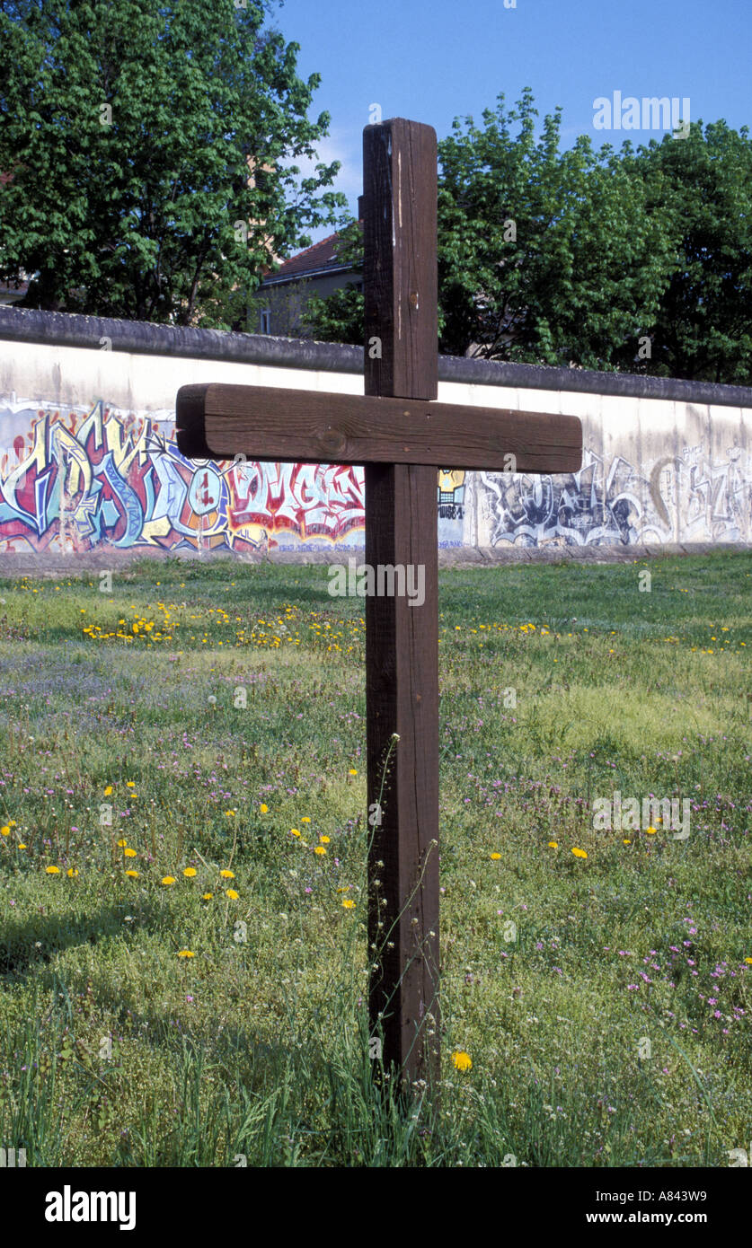 Germany Berlin a memorial cross stands in front of one of the few ...