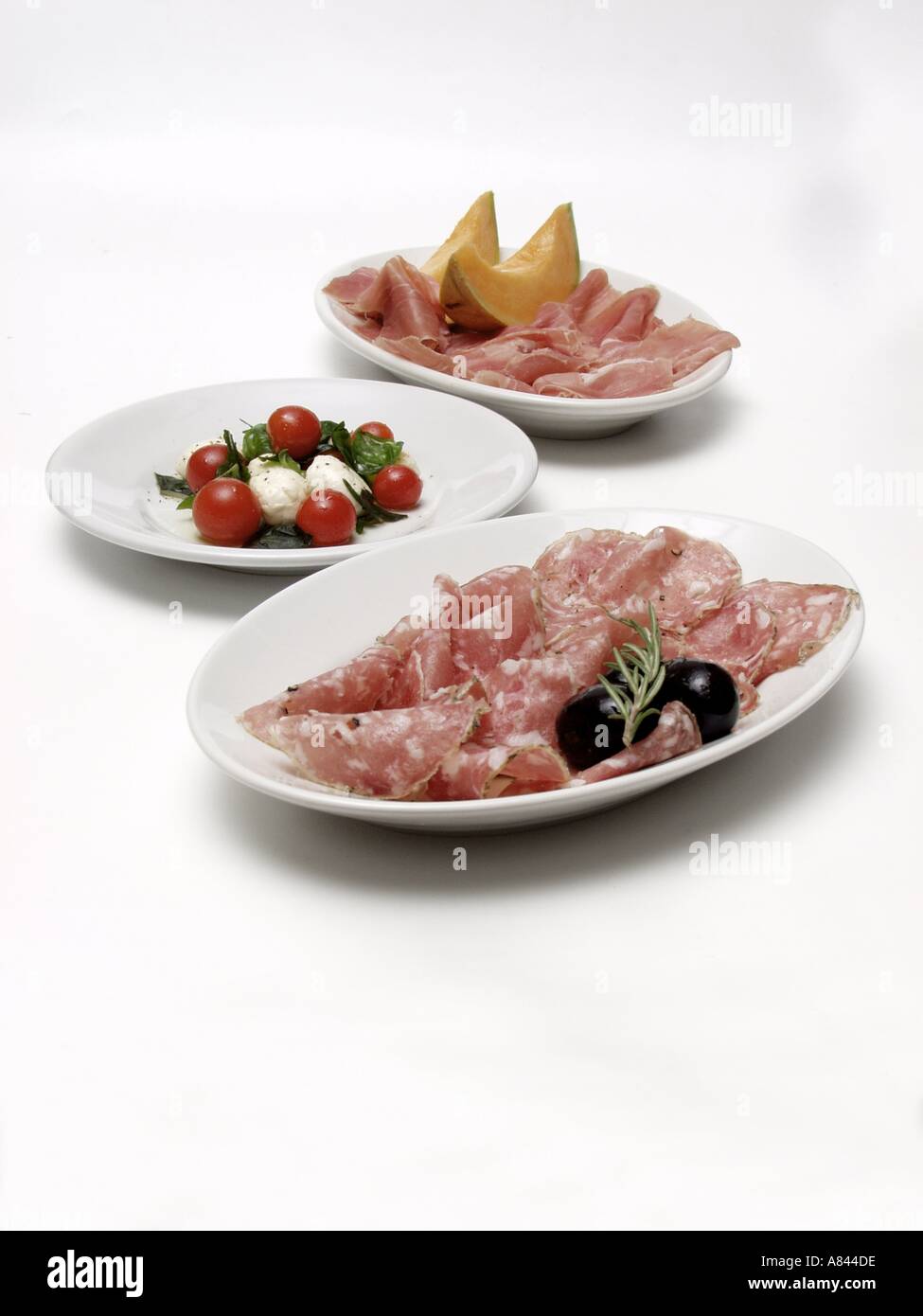 Three Plates of Italian Appetizers Stock Photo - Alamy