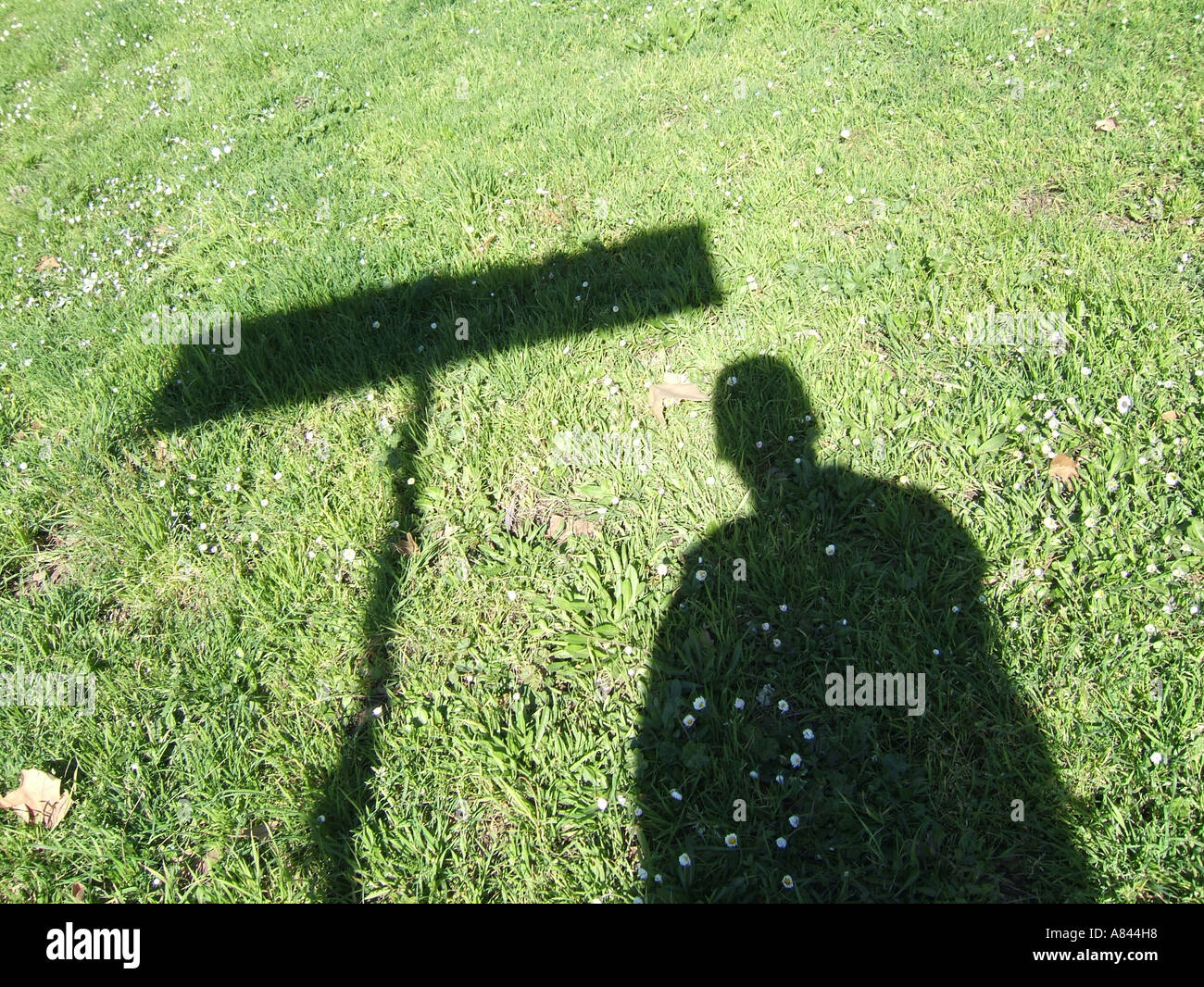 sign and man shadow in grass Stock Photo - Alamy
