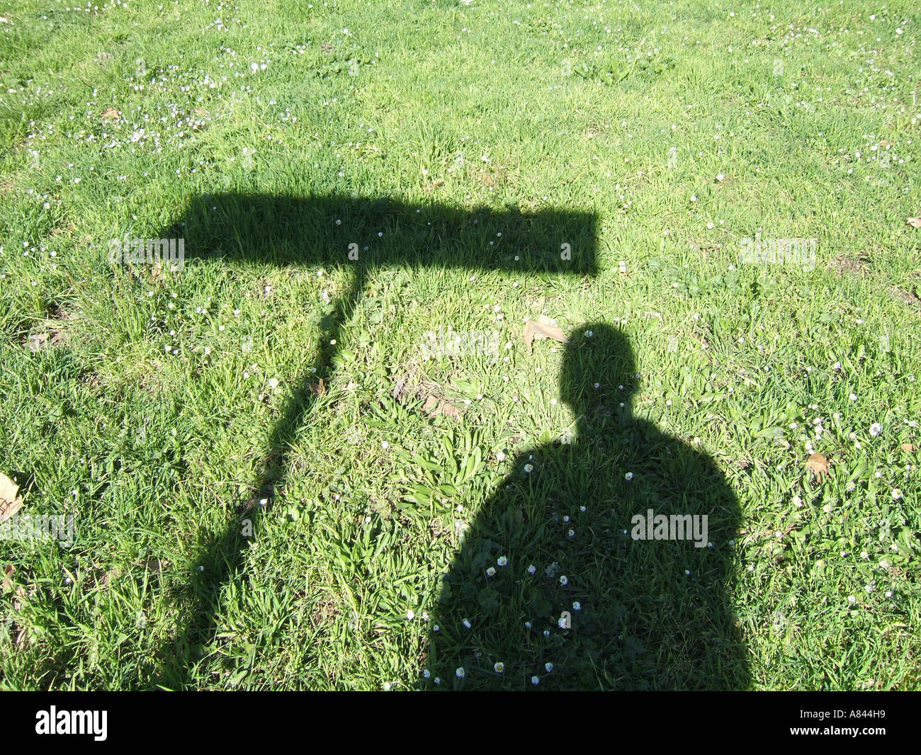 sign and man shadow in grass Stock Photo - Alamy