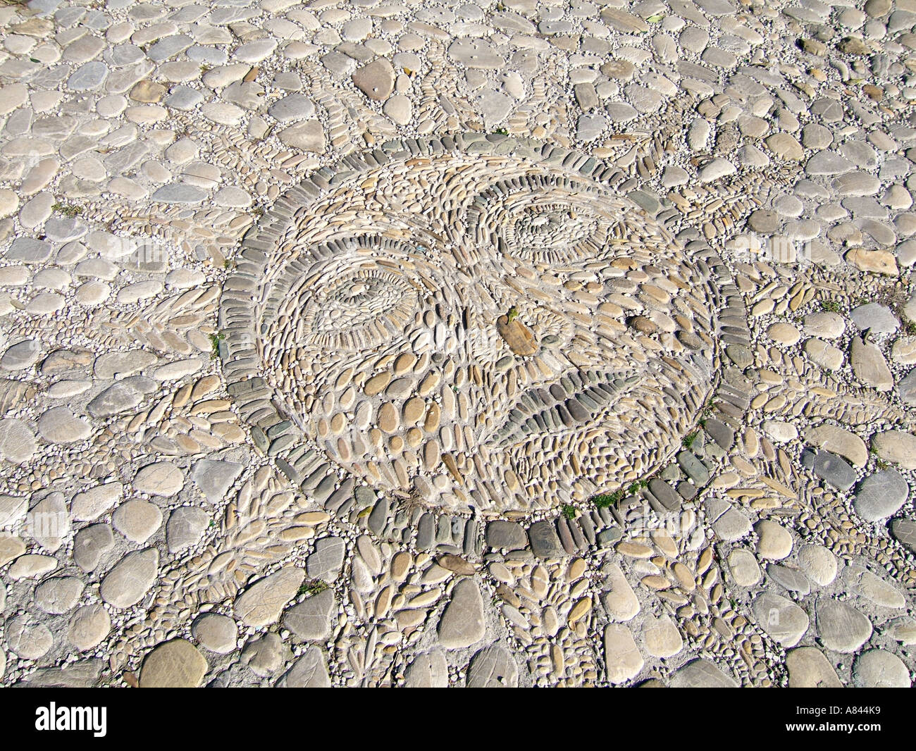 sun figure face made out of stonea and pebbles Stock Photo - Alamy