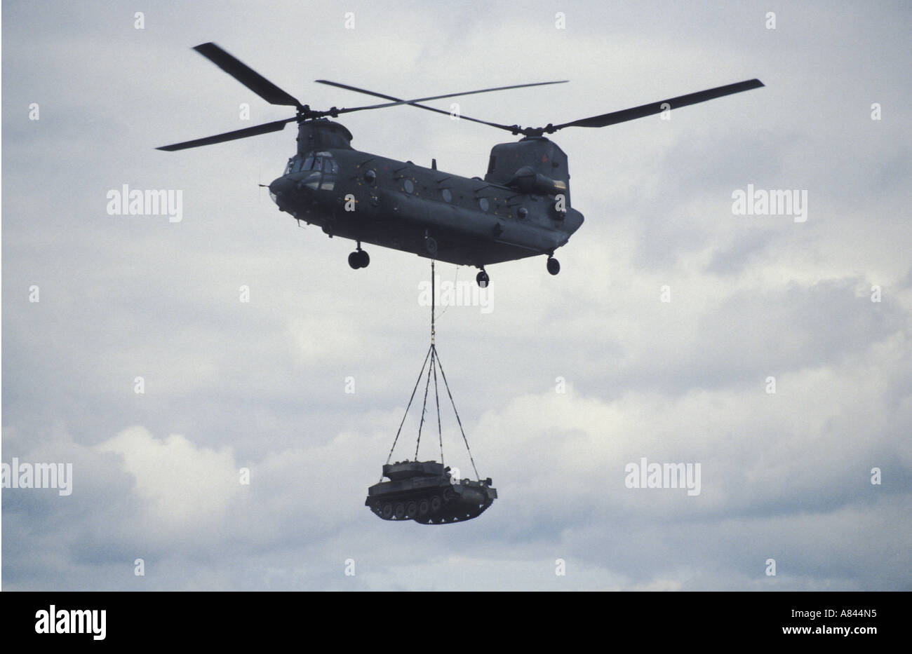 British Army Chinook helicopter with under slung Scimitar Combat ...