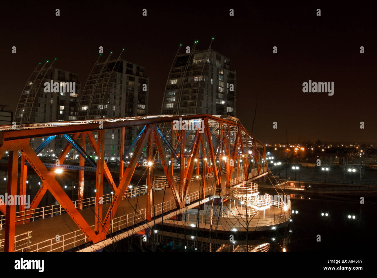 A bridge in Manchester lit up by the night lights Stock Photo - Alamy