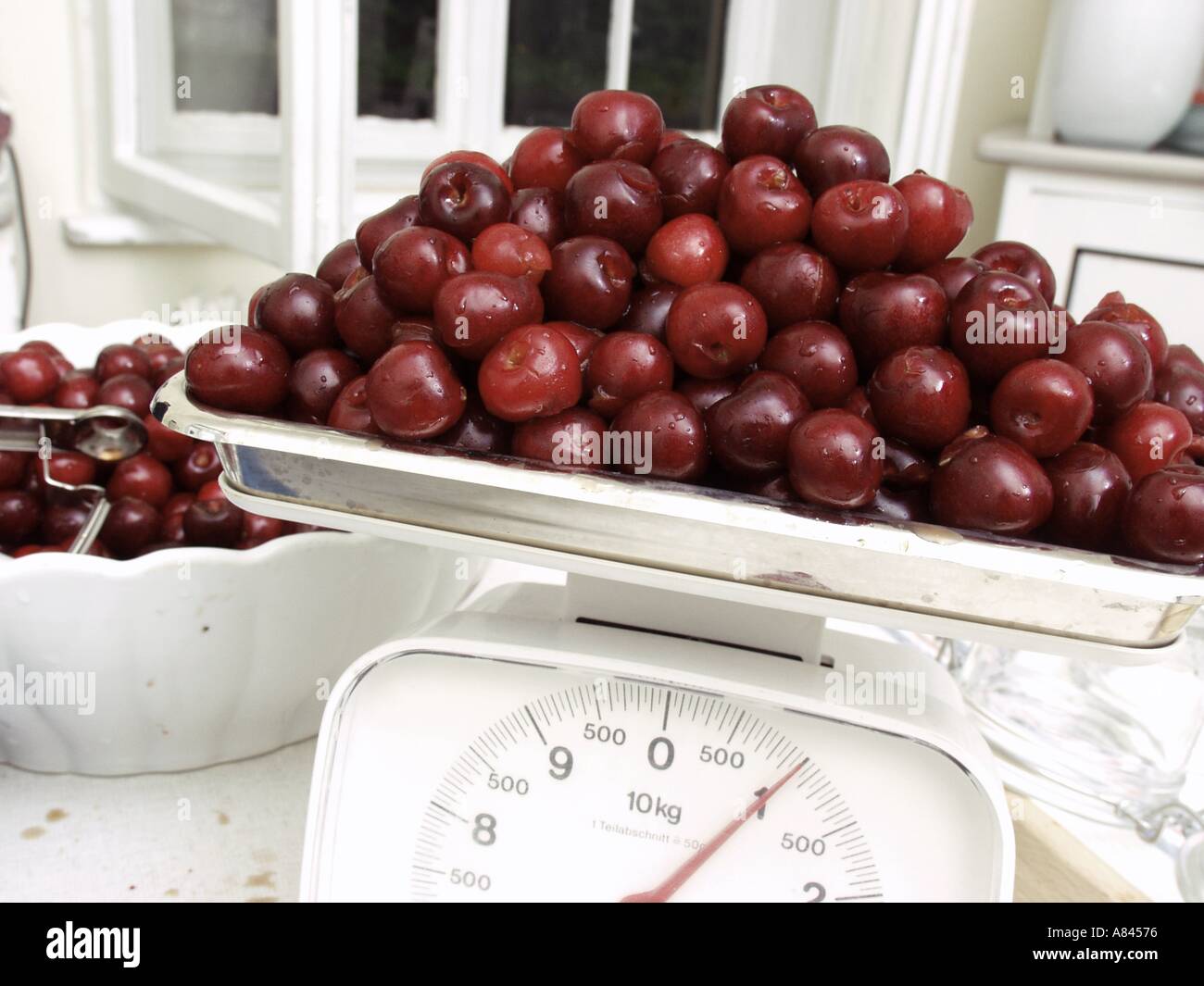 Cherries on a Scale Stock Photo - Alamy