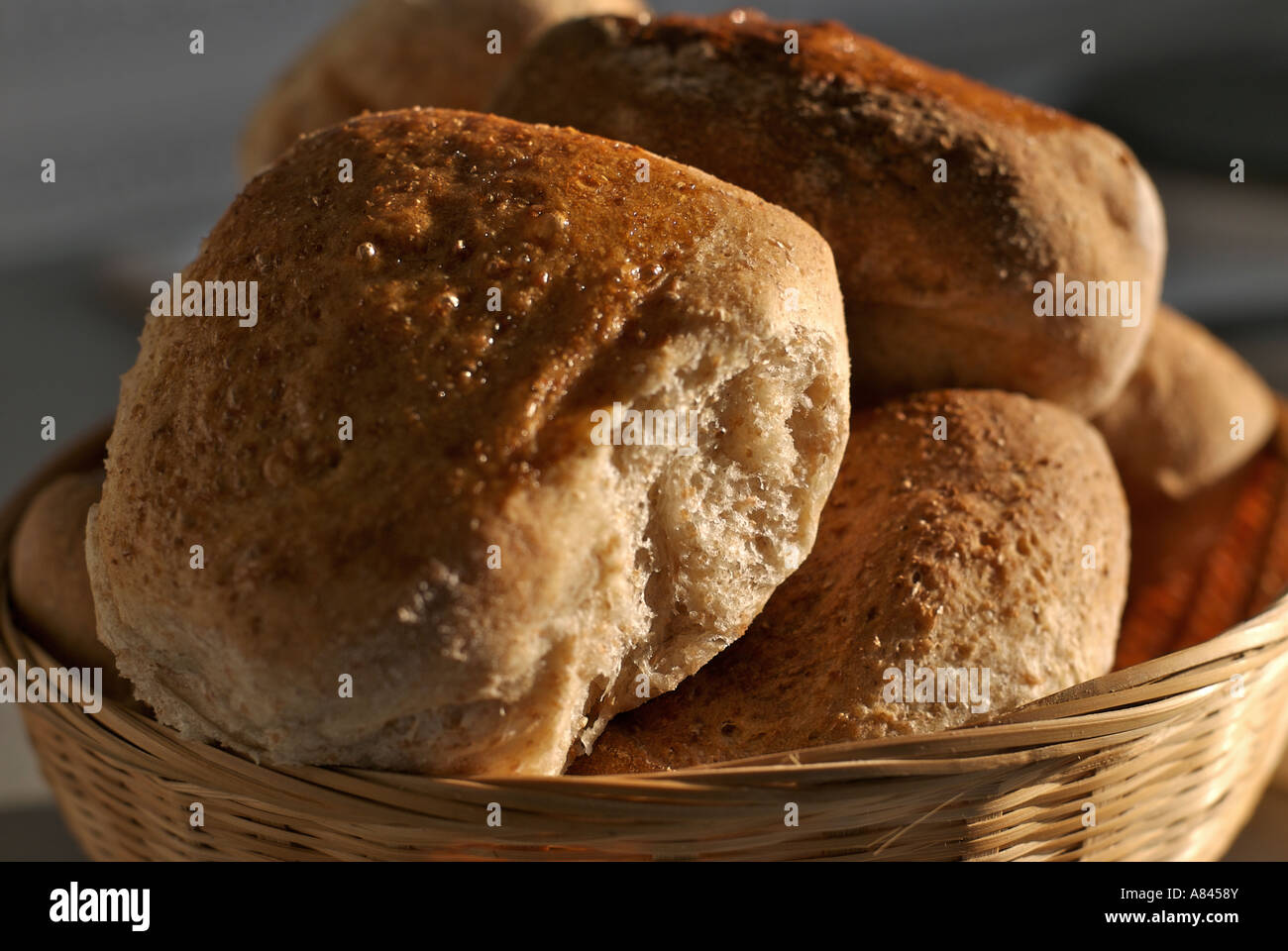 A batch of freshly cooked rolls in a wicker basket Stock Photo - Alamy