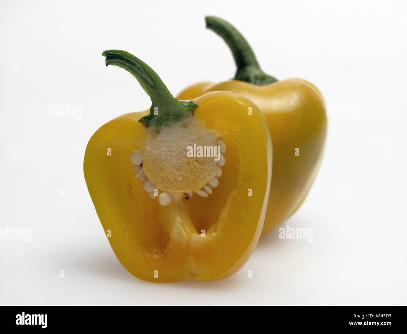 Whole and Half of a Yellow Bell Pepper Stock Photo - Alamy