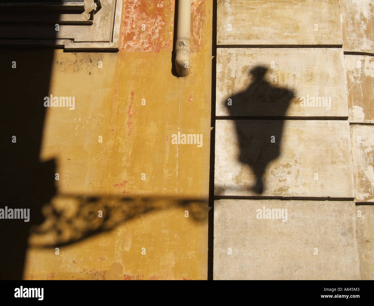 lamp post shadow on wall in rome Stock Photo - Alamy
