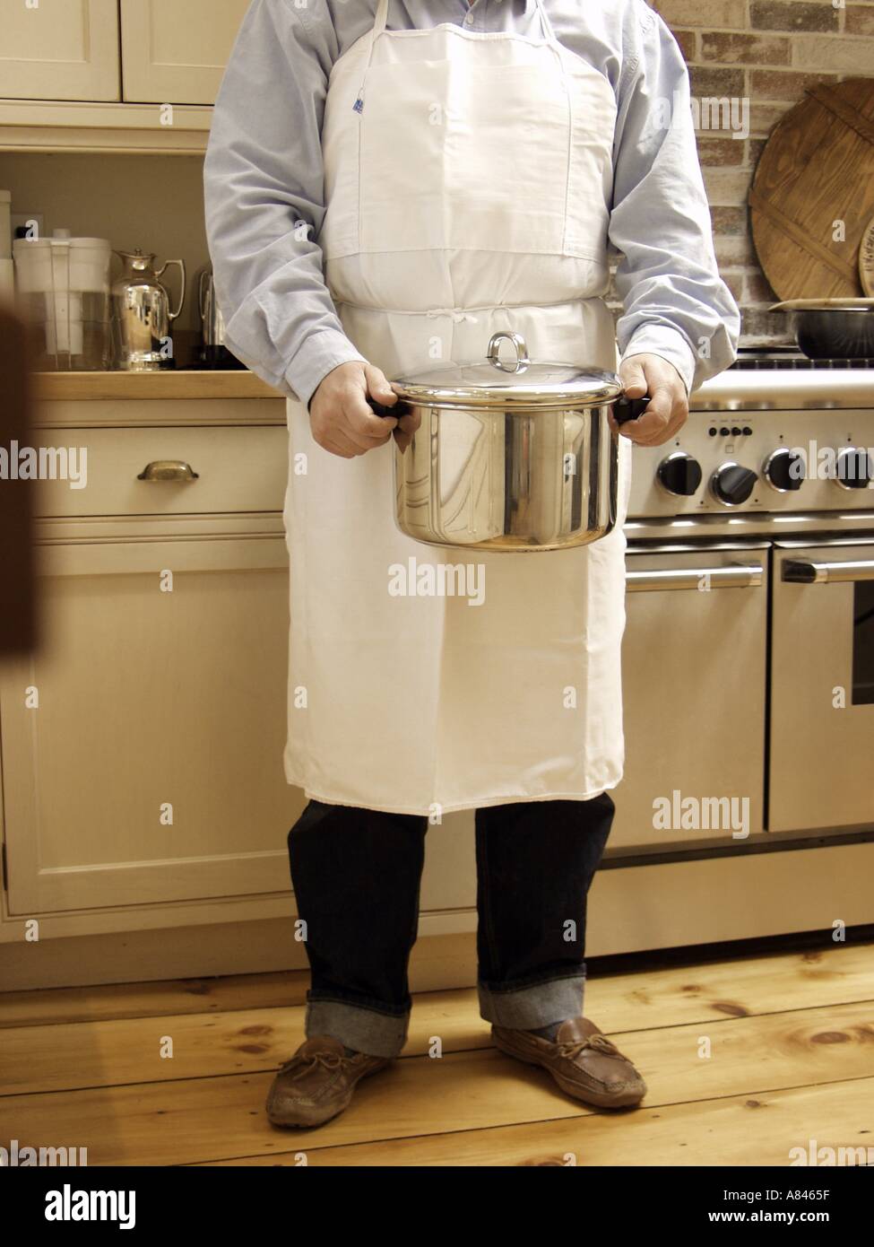 Man Holding a Stock Pot Stock Photo - Alamy