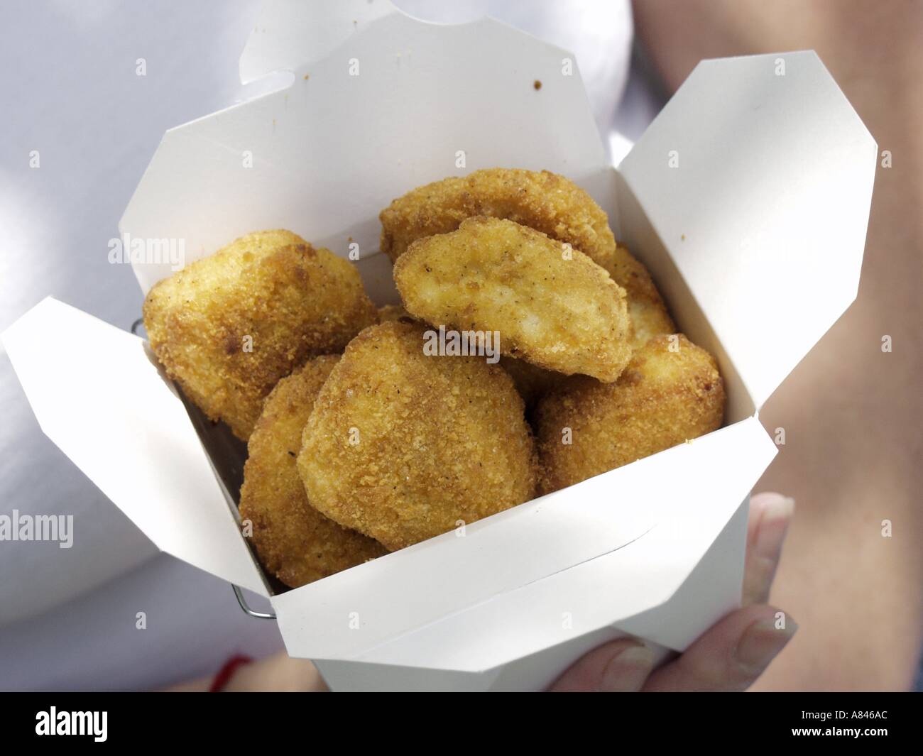Holding a Box of Chicken Nuggets Stock Photo - Alamy