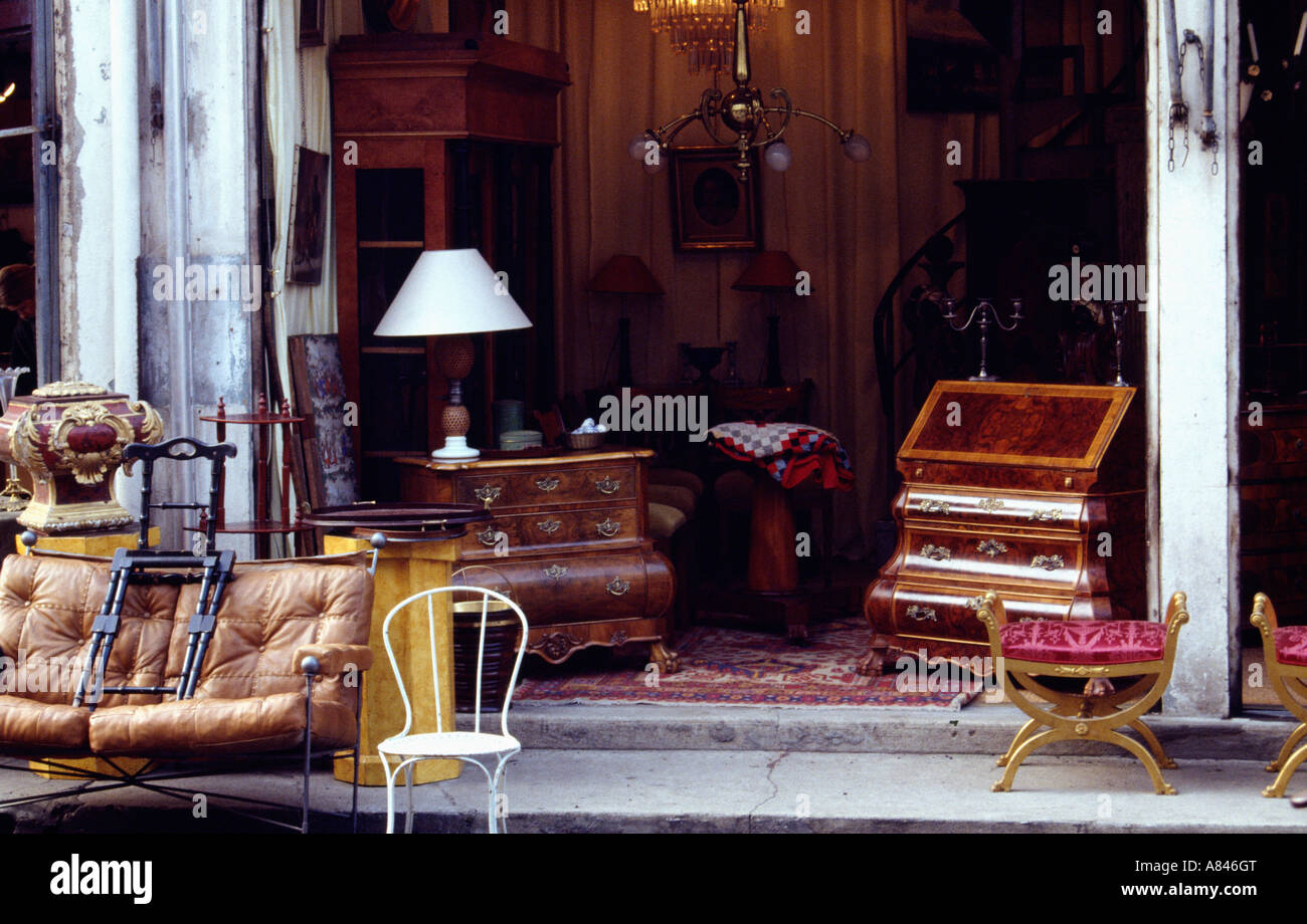 Furniture outside large open doorway of antique shop in Paris Stock ...