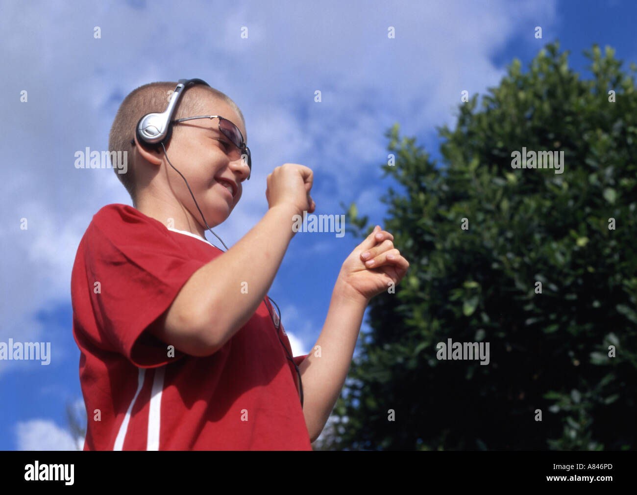 kid dancing in garden Stock Photo - Alamy