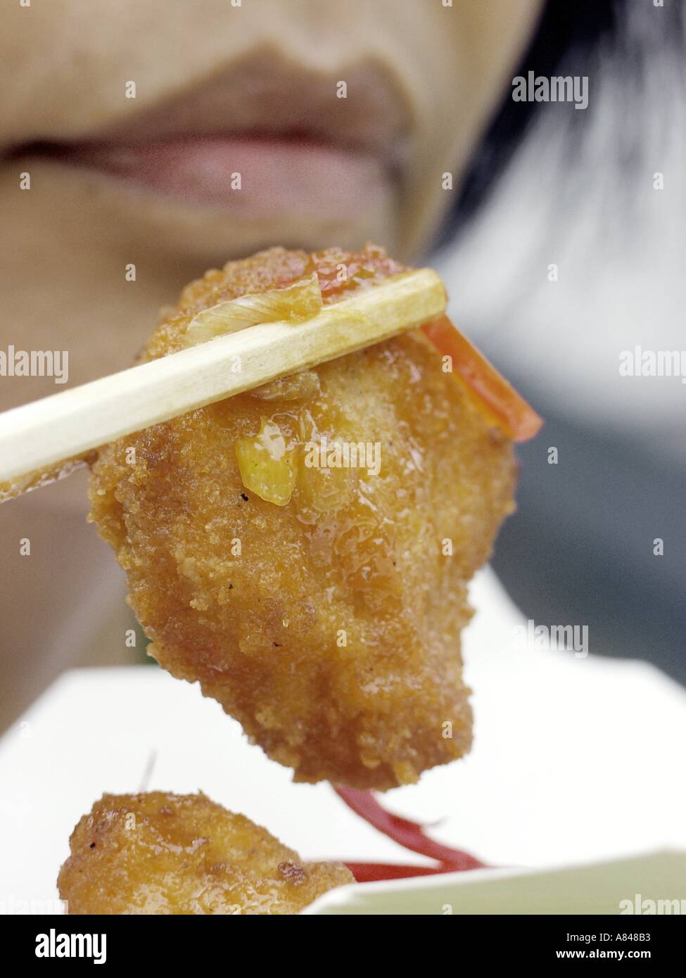 Eating a Chicken Nugget Stock Photo - Alamy