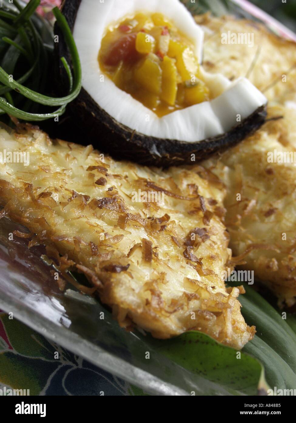 Fried Catfish with Mango Salsa in a Coconut Shell Stock Photo - Alamy