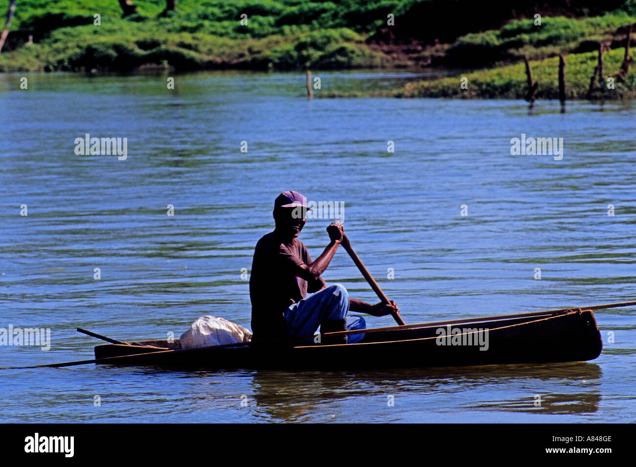 Belize fisherman on Belize river Stock Photo - Alamy