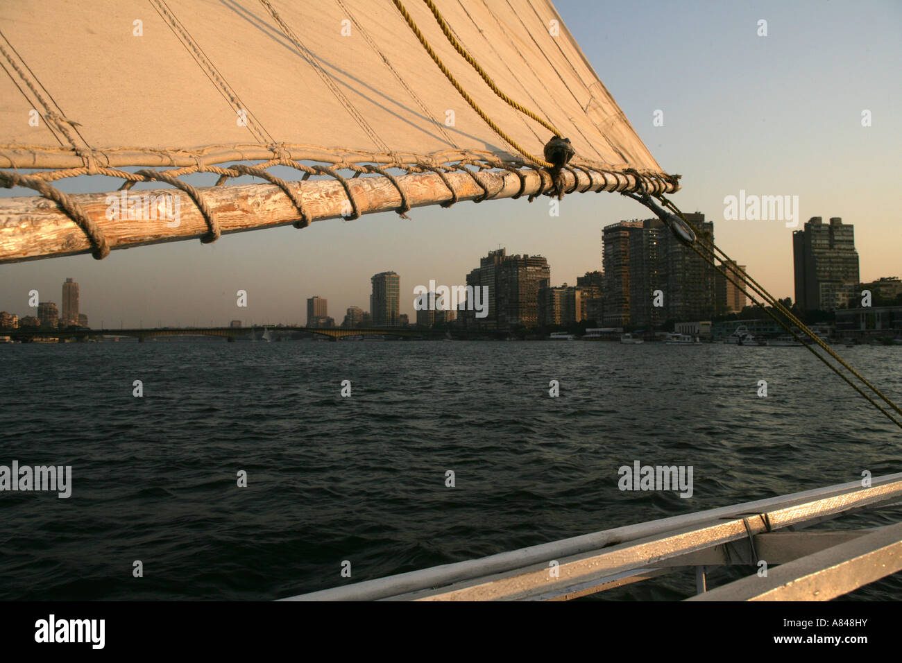 Sailing boat on River Nile and waterfront skyline, Cairo, Egypt, Middle ...