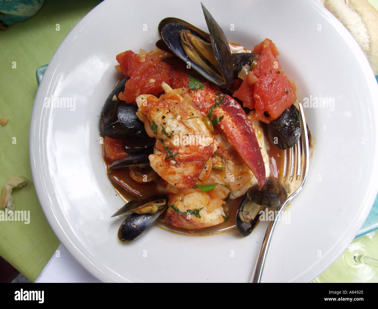 Creole lobster and mussel stew with tomatoes Stock Photo - Alamy