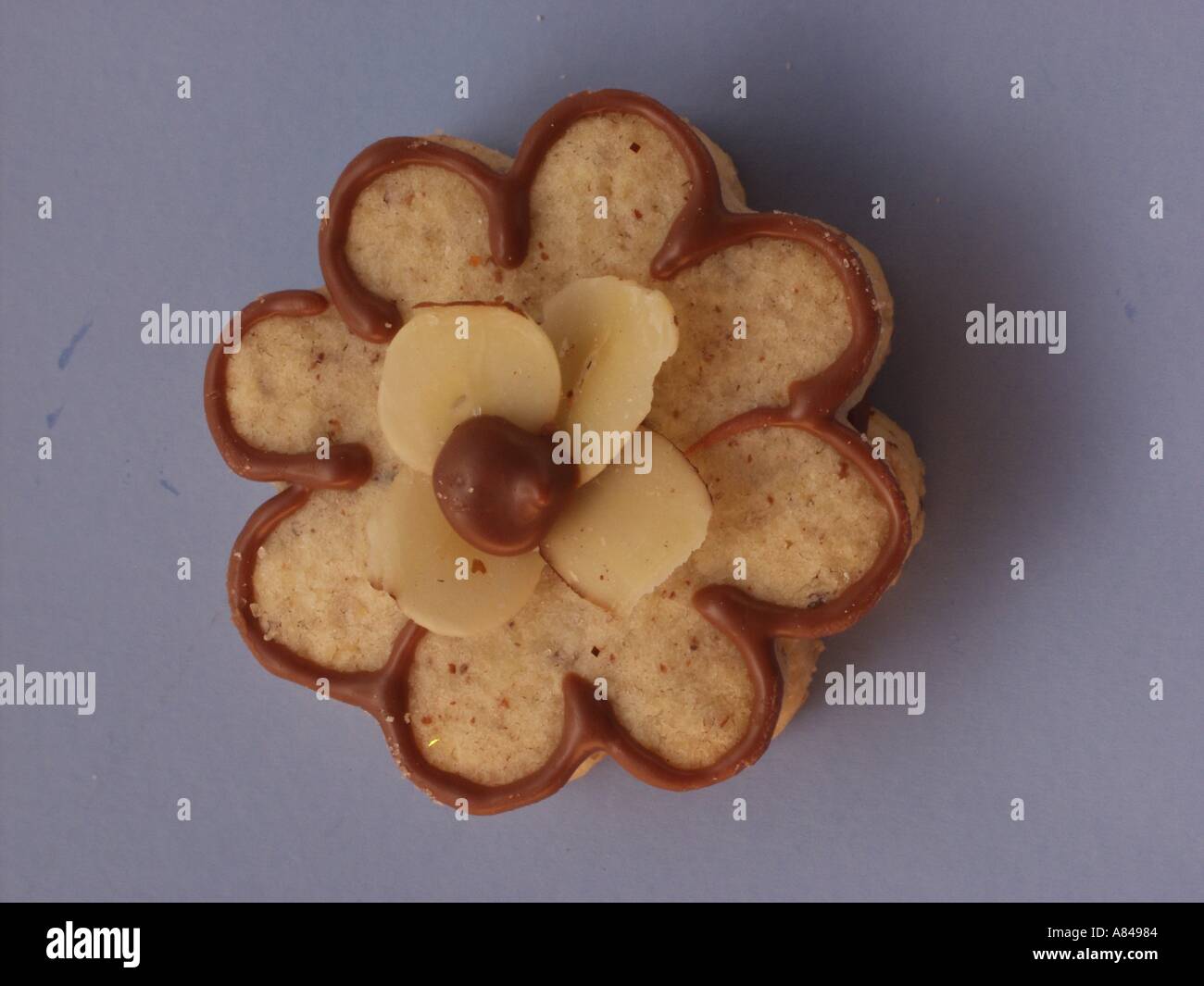 Nut nougat flower with flaked hazelnuts Stock Photo - Alamy
