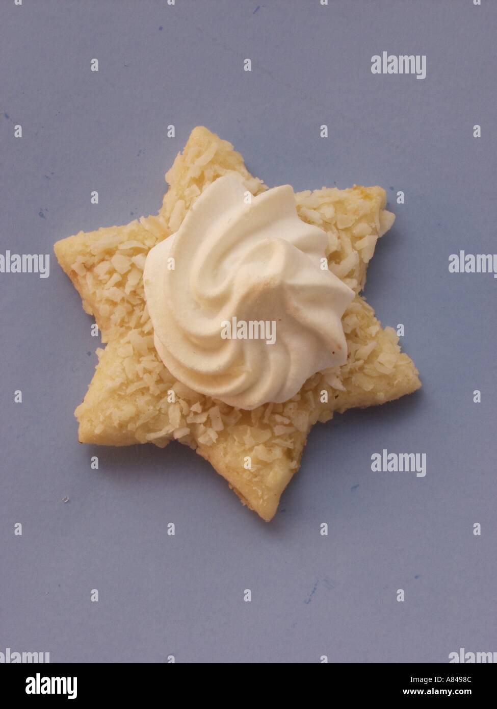 Coconut star with meringue topping Stock Photo - Alamy