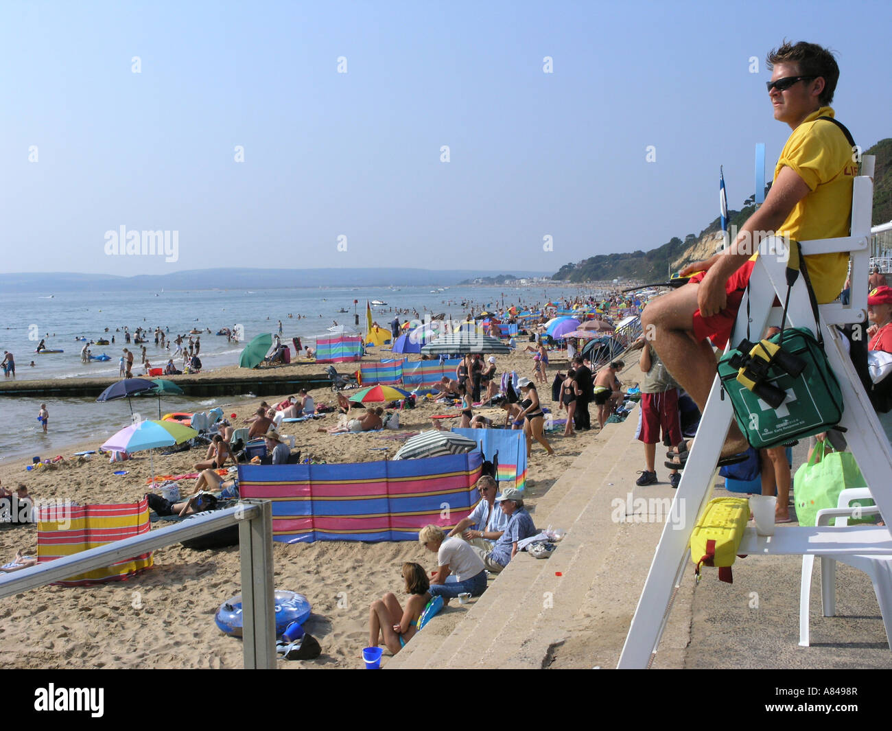 bournemouth beach life guard crowded beach holidaymakers dorset england ...